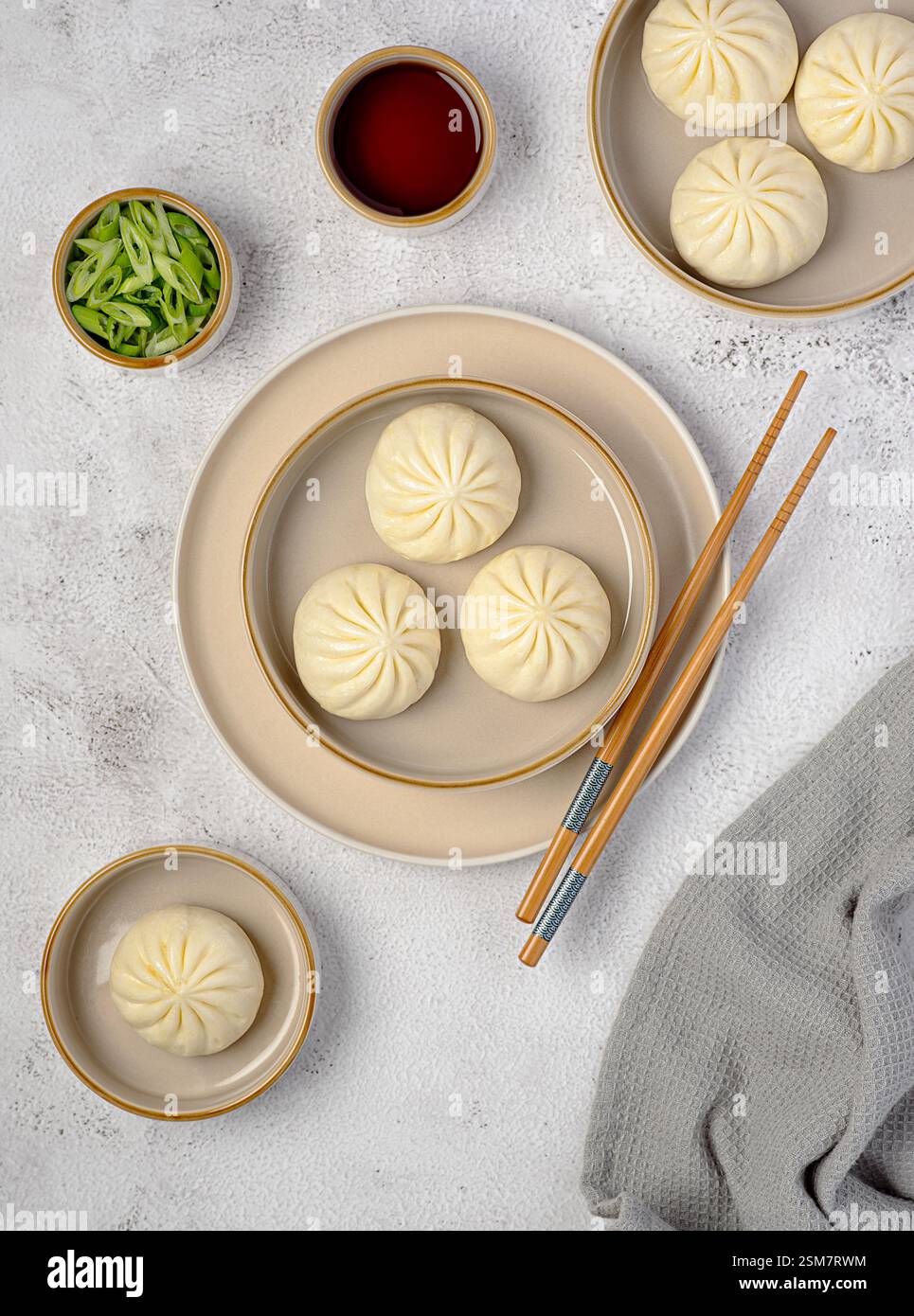 Food photography of steamed duck bao buns, spring onion, soy sauce ...