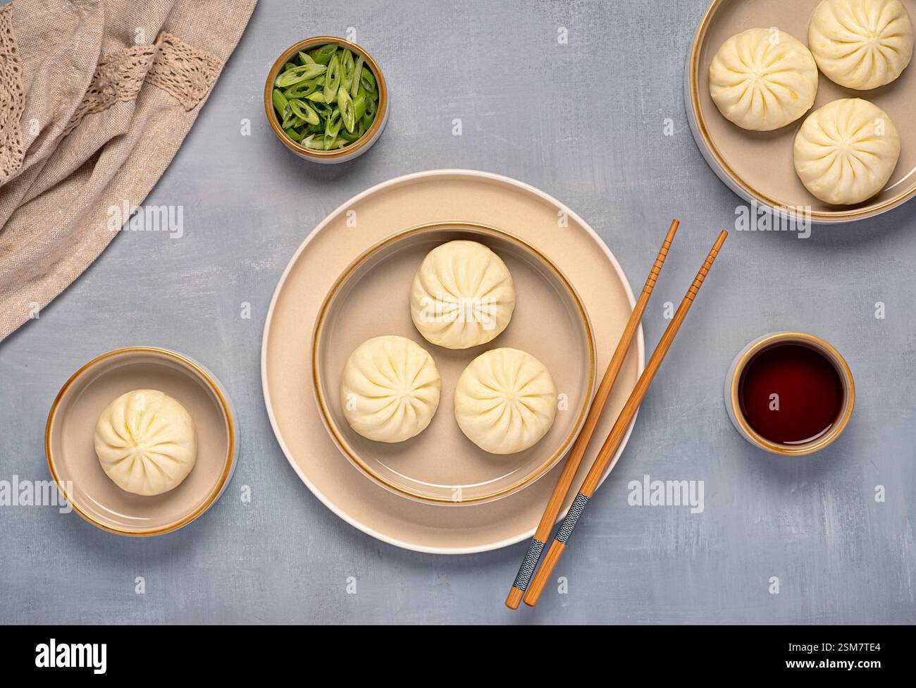 Food photography of steamed duck bao buns, spring onion, soy sauce ...