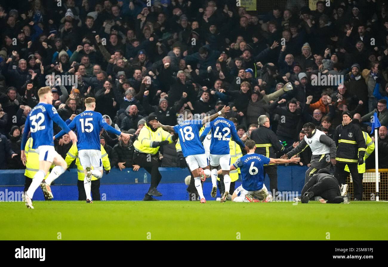 Everton's James Tarkowski (centre) celebrates scoring their side's ...