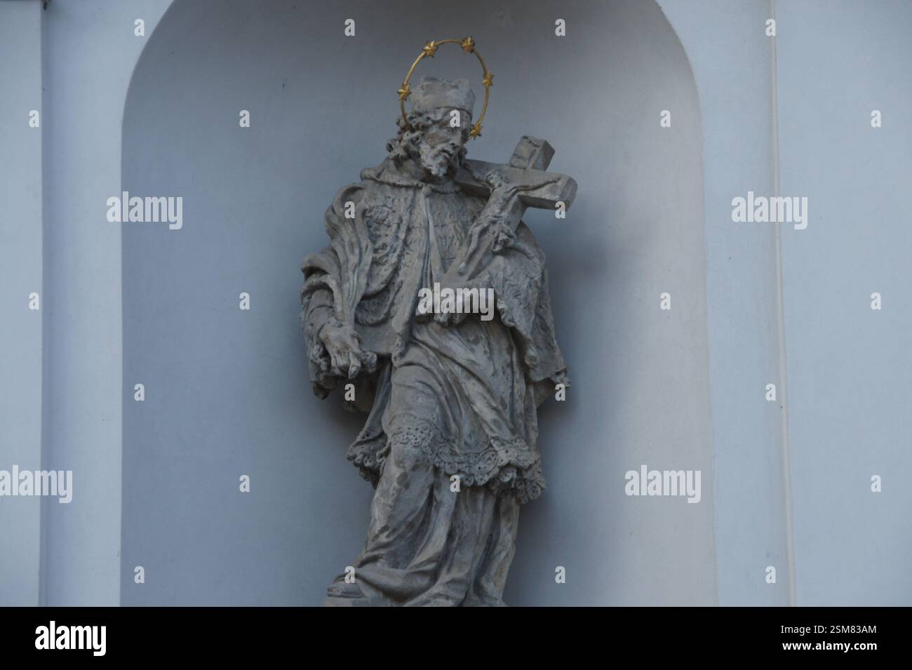 Statue of a man with a cross in the Czech Republic. Religious figure ...