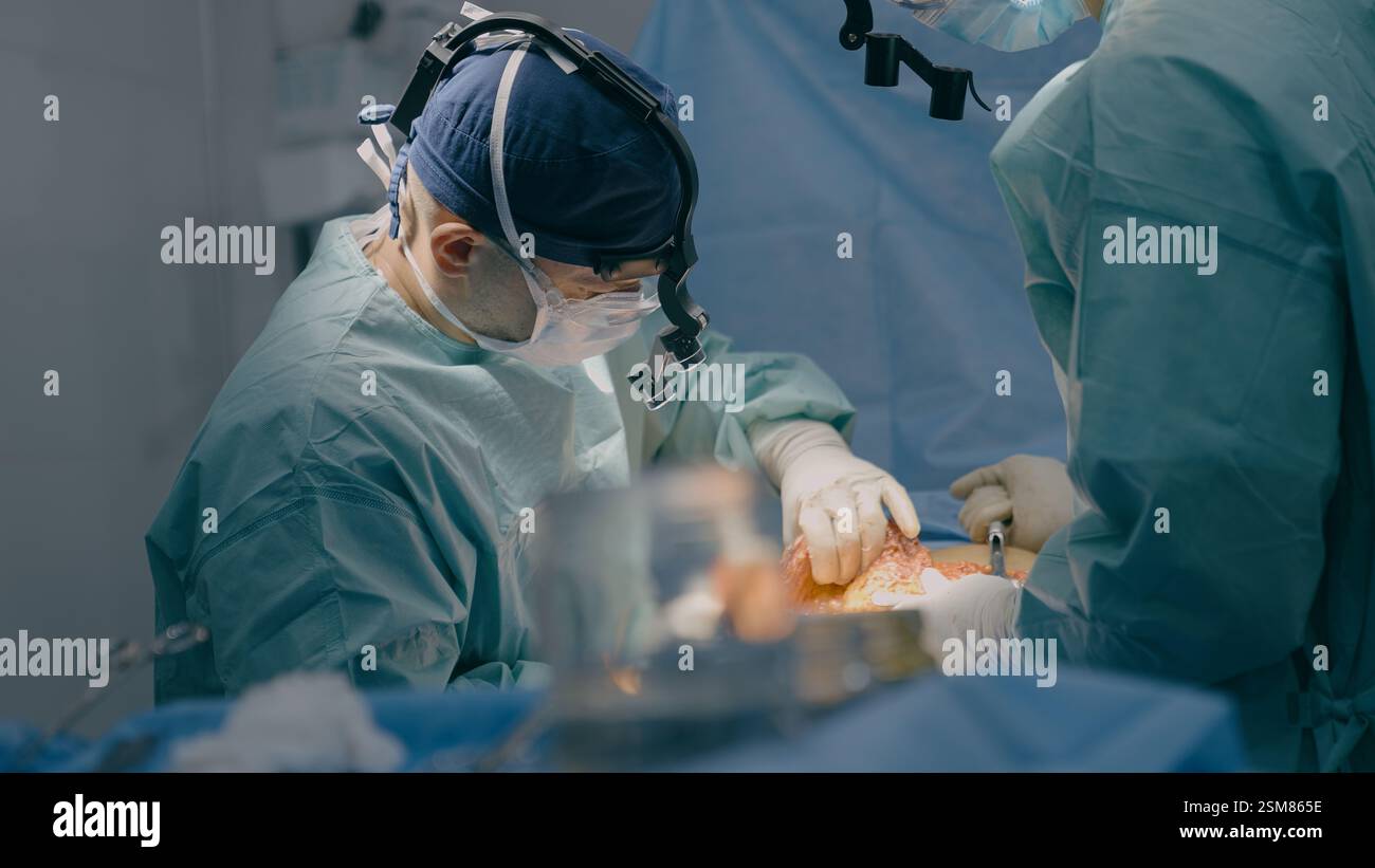 Group of surgeons men doctors physicians in medical masks process ...