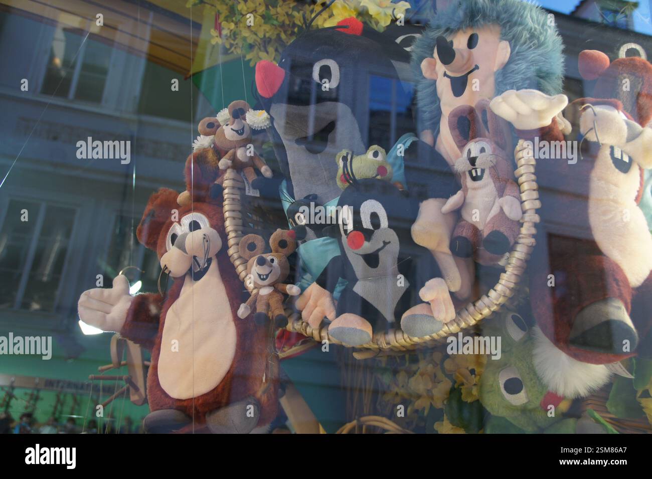 Toy shop window display. Stuffed animals of various cartoon characters ...