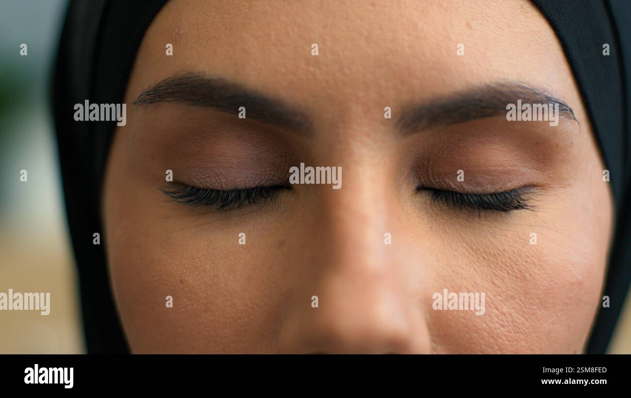 Close up view macro extreme woman Muslim islamic female in hijab arabic girl eyes closed healthy ...