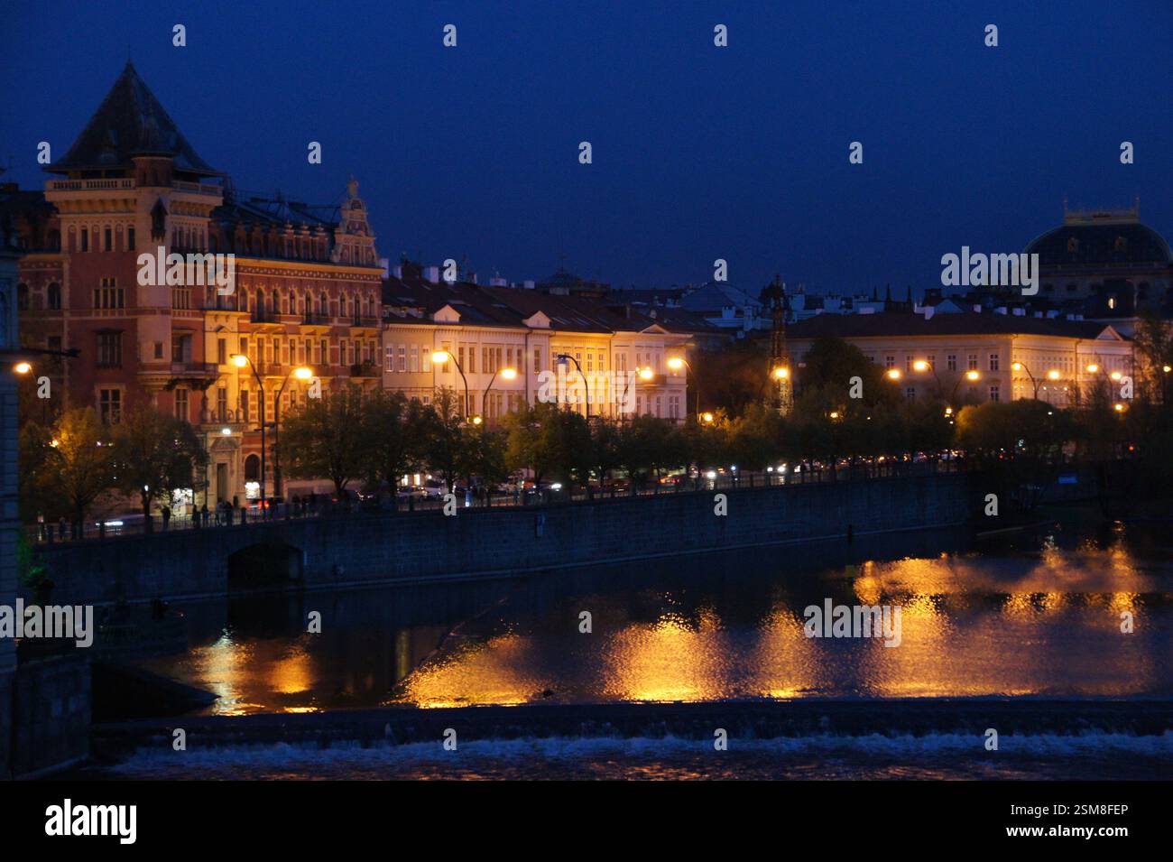 Charles Bridge, a symbol of Prague, stretches across the Vltava River ...