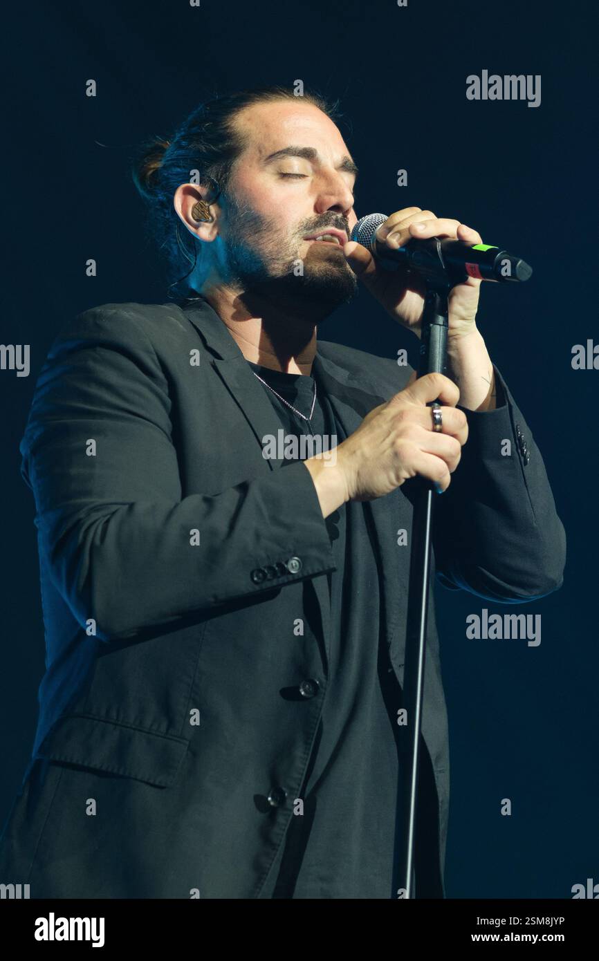 Singer-songwriter Andres Suarez performs during the tribute concert to ...
