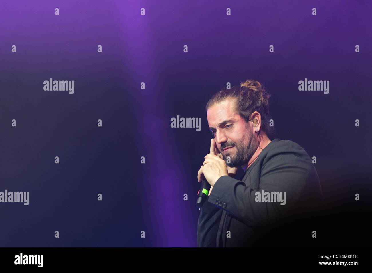 Singer-songwriter Andres Suarez performs during the tribute concert to ...