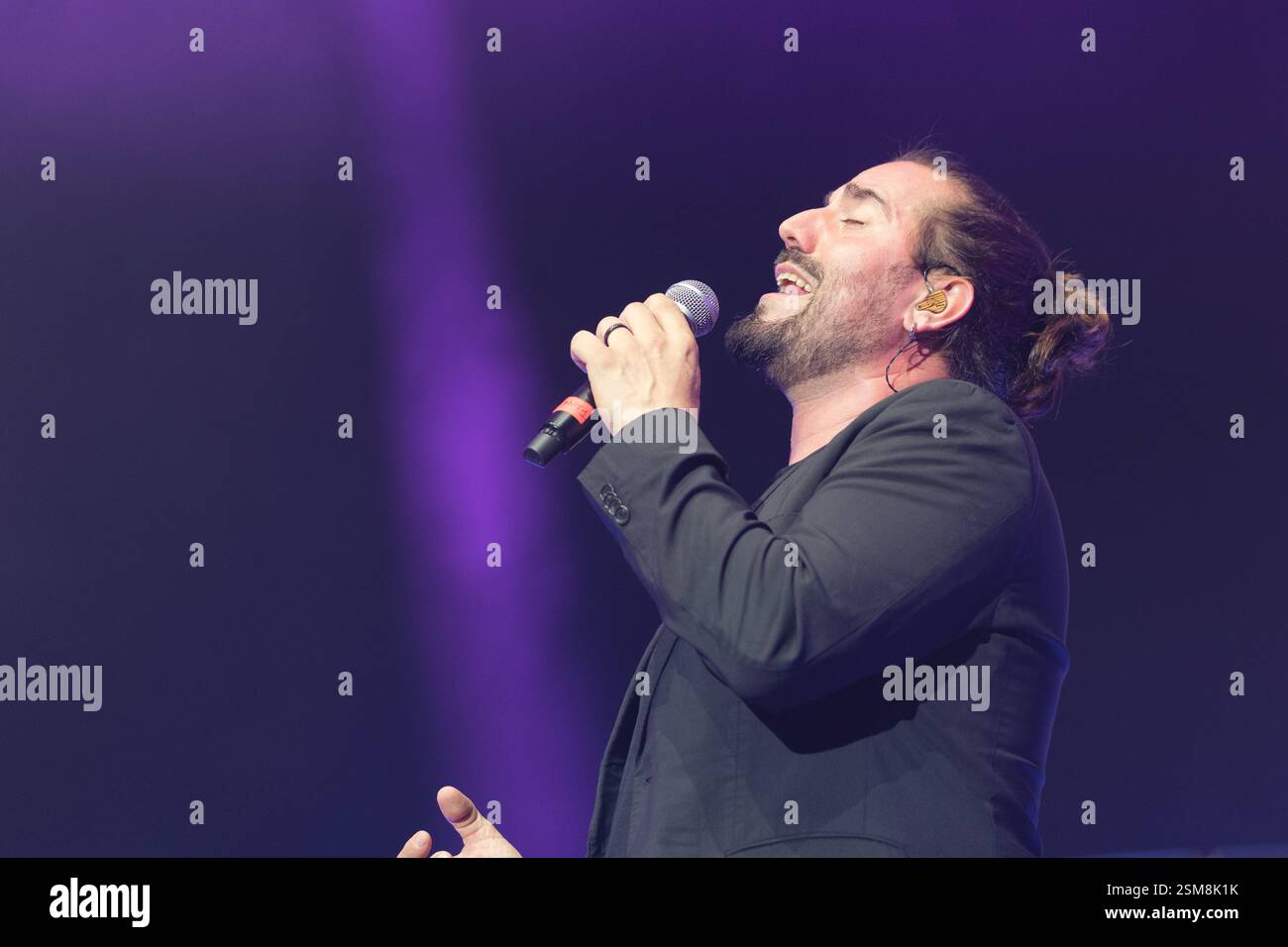 Singer-songwriter Andres Suarez performs during the tribute concert to ...