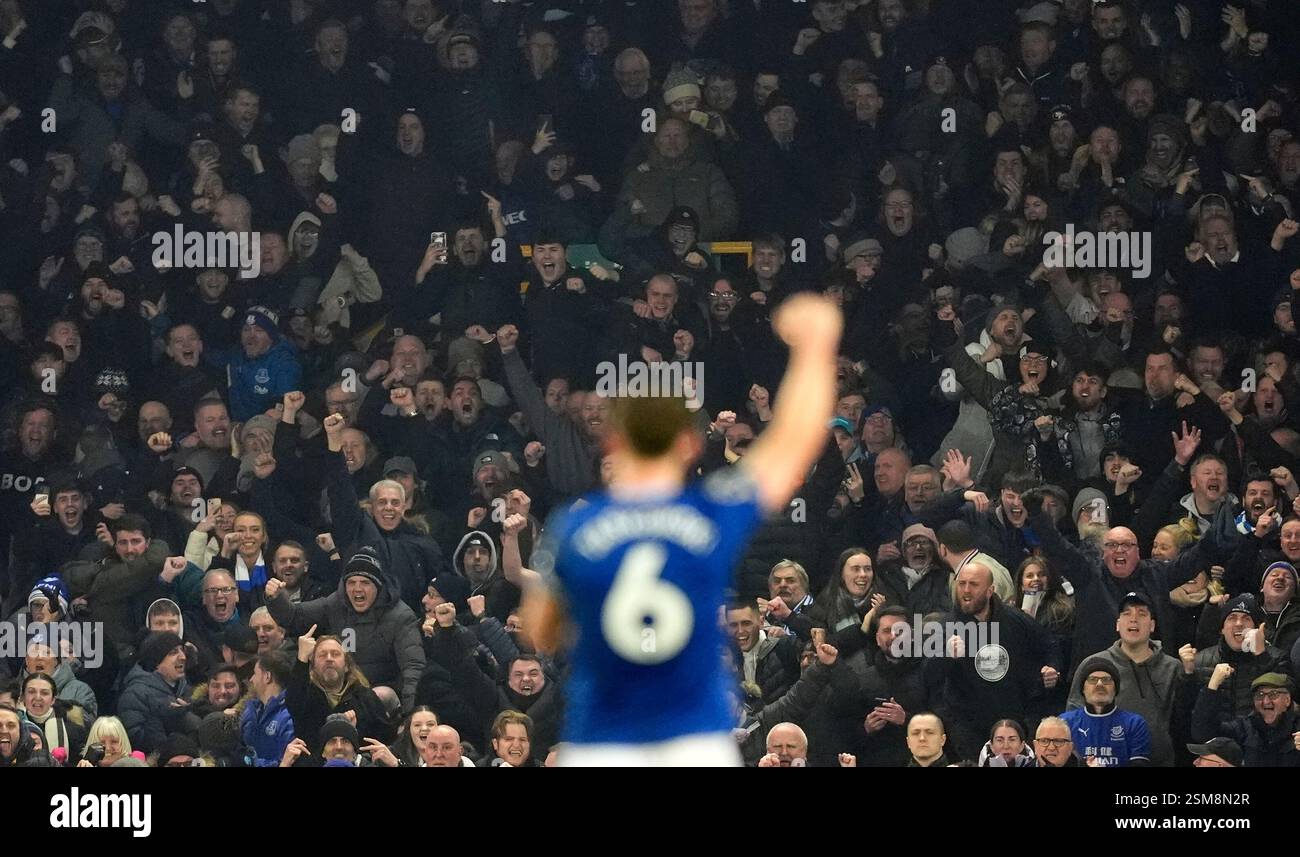 Everton's James Tarkowski celebrates with fans in the background after ...