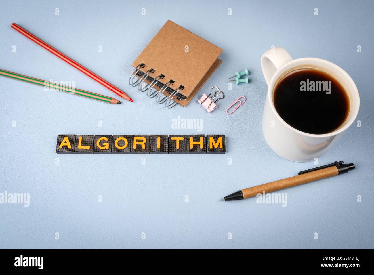 Algorithm. Text from old alphabet letters. Coffee mug on the table ...
