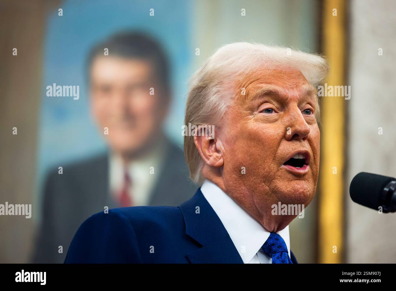 Washington, United States. 12th Feb, 2025. With a portrait of former ...