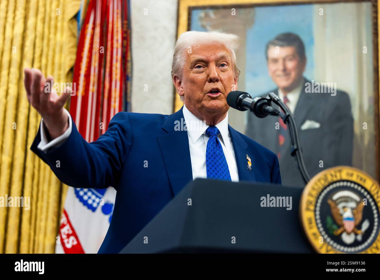 Washington, United States. 12th Feb, 2025. With a portrait of former ...