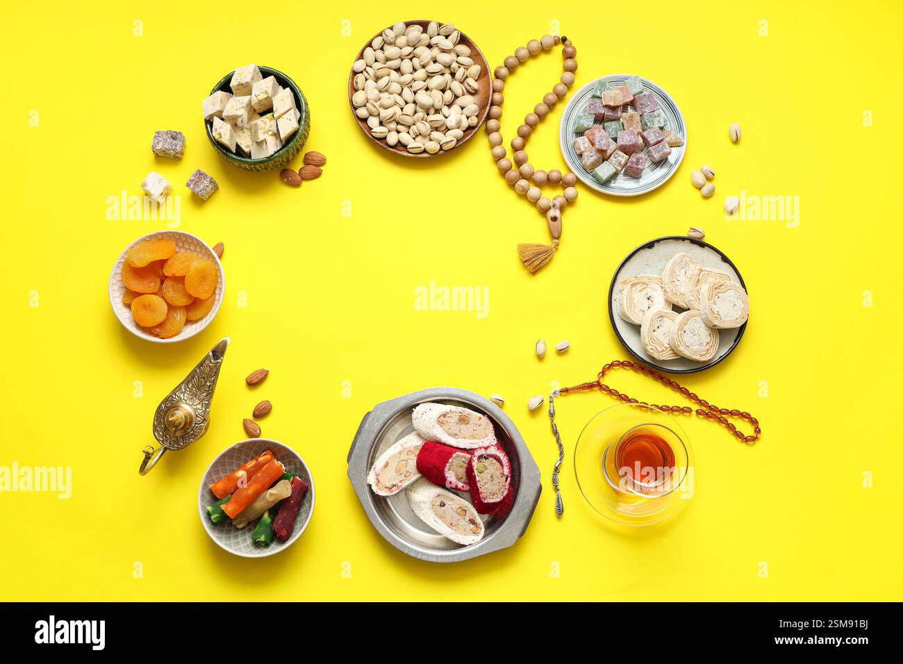 Frame made of different Eastern sweets, Aladdin lamp and tasbih for ...