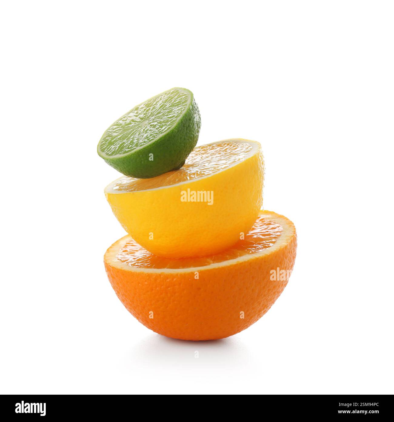 Halves of different citrus fruits on white background Stock Photo - Alamy