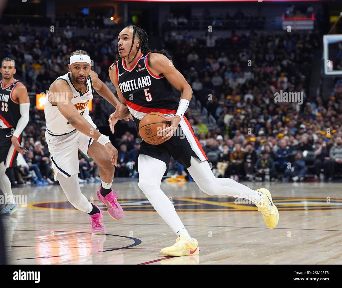 Portland Trail Blazers guard Dalano Banton (5) drives past Denver ...