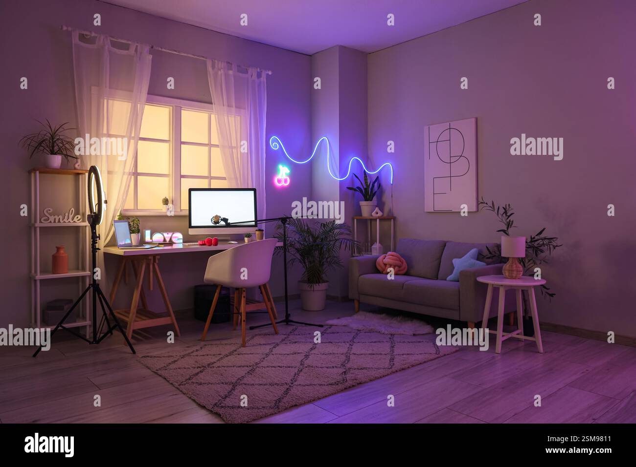 Interior of blogger's room with workplace and sofa at night Stock Photo ...