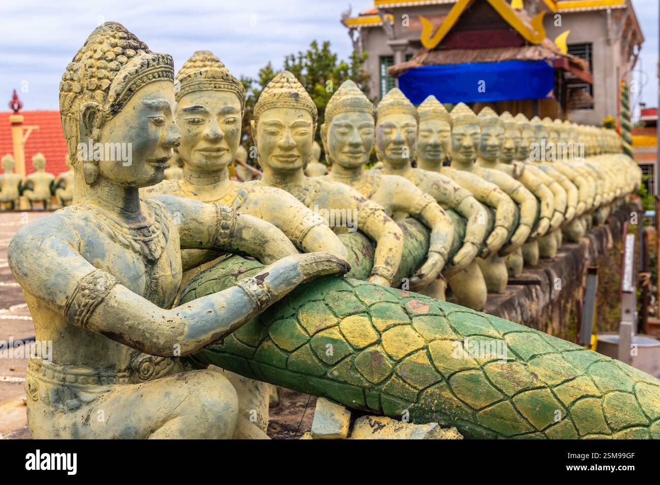 Many asura titans statues holding Naga snake statue, North Phnom Prasit pagoda, Phnom Penh ...