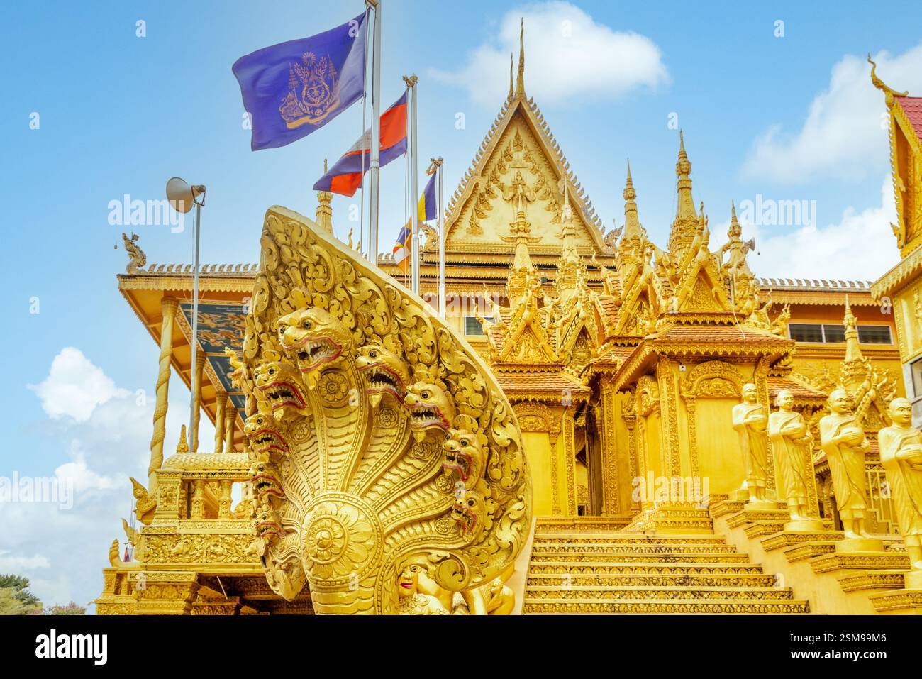 Wat Kean Kleang golden buddhist pagoda temple walls, stairs and Naga ...