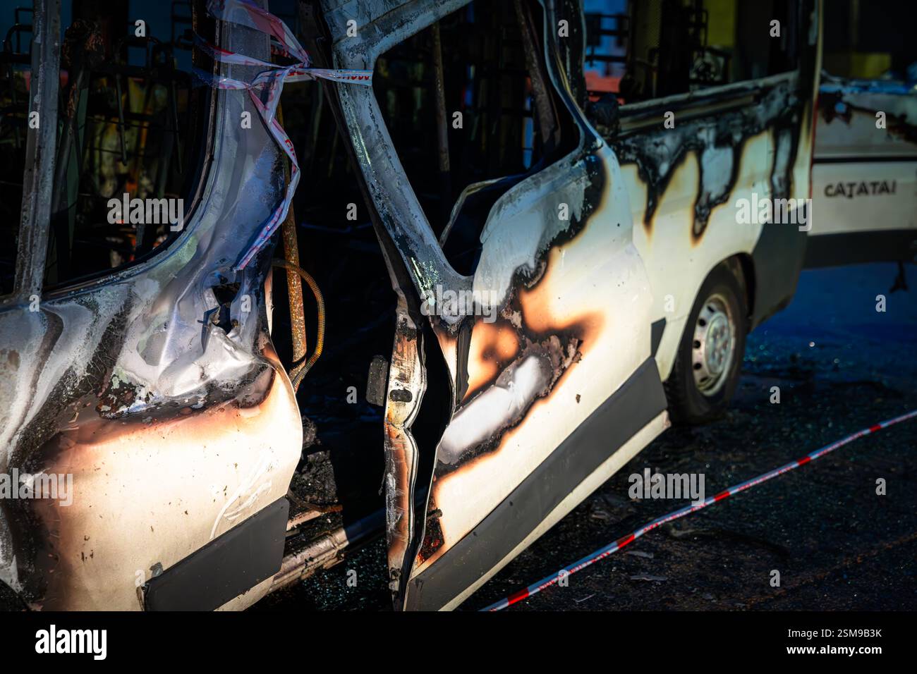 Burnt white van with open doors showing fire and burn damage and police ...