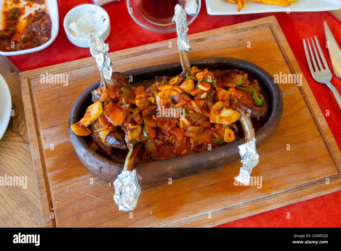 Traditional Turkish lamb chop casserole with vegetables and mushrooms ...