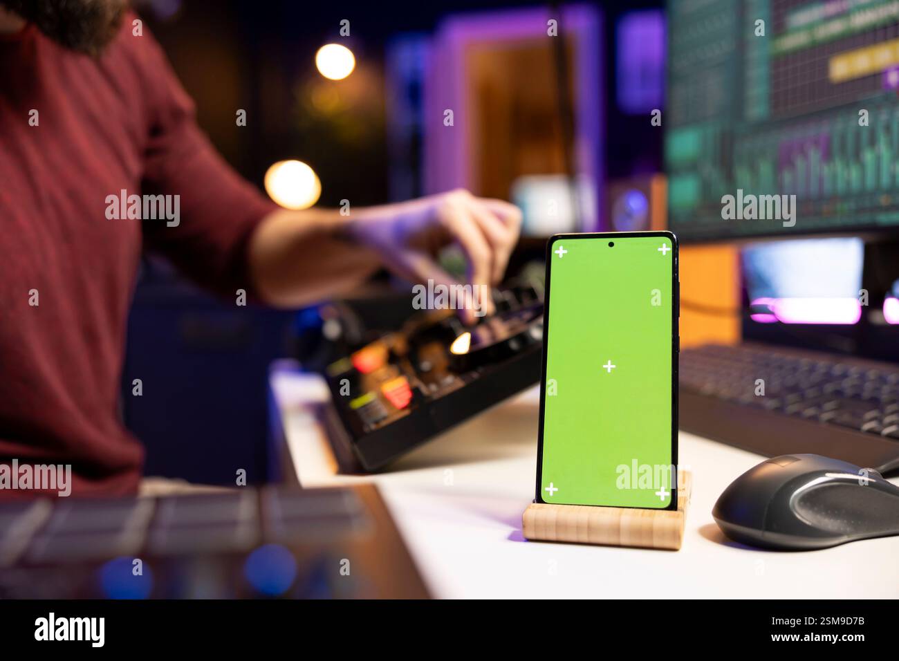 Sound engineer uses controls and amplifier on mixing console to create ...