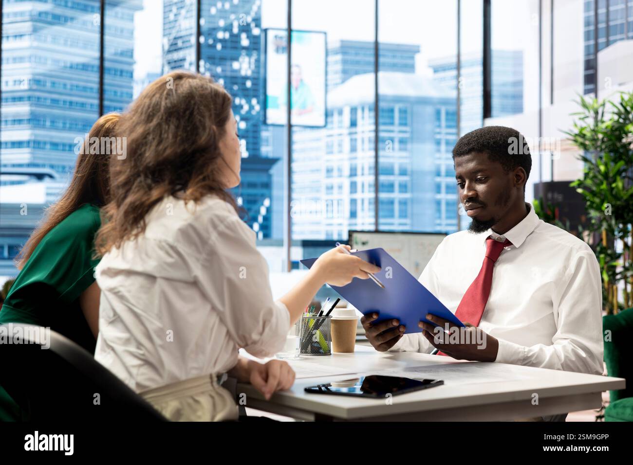 HT staff members checking if job candidate qualifications are aligned ...