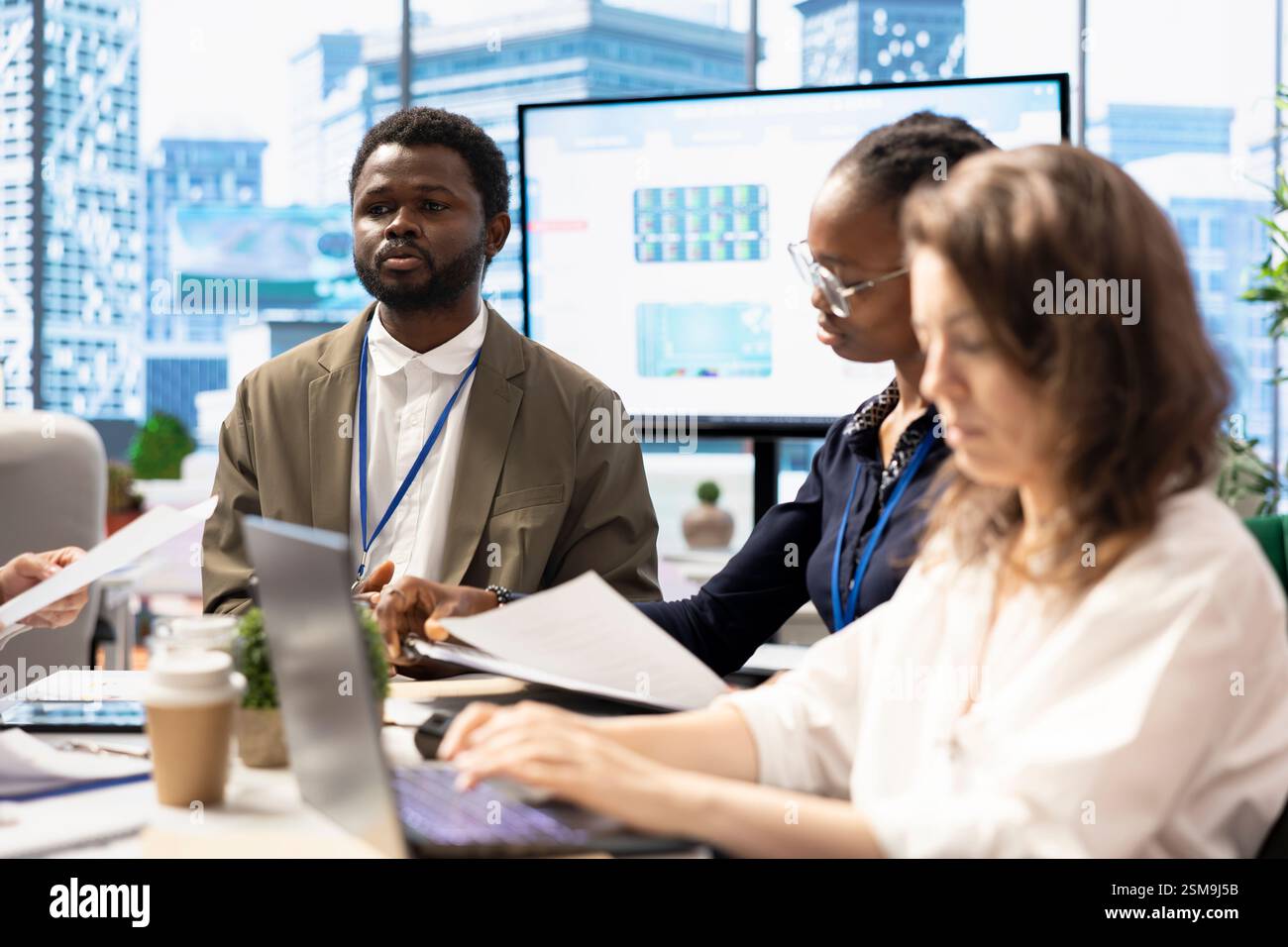 Forecast affiliates collaborating in a high end workspace to determine ...