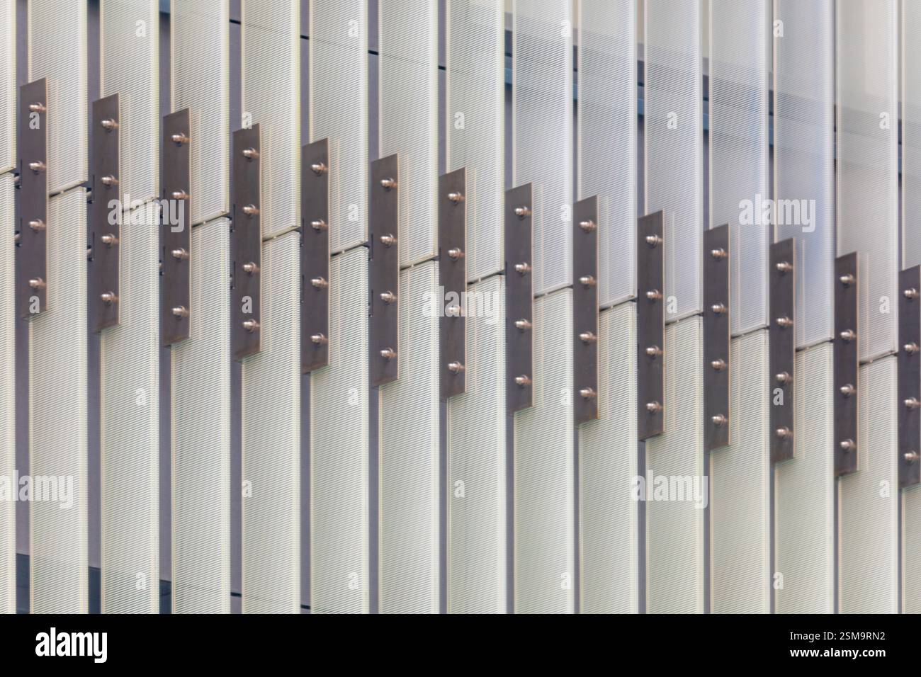 Modern Building Exterior with Vertical Metallic Lines and Glass Facade ...