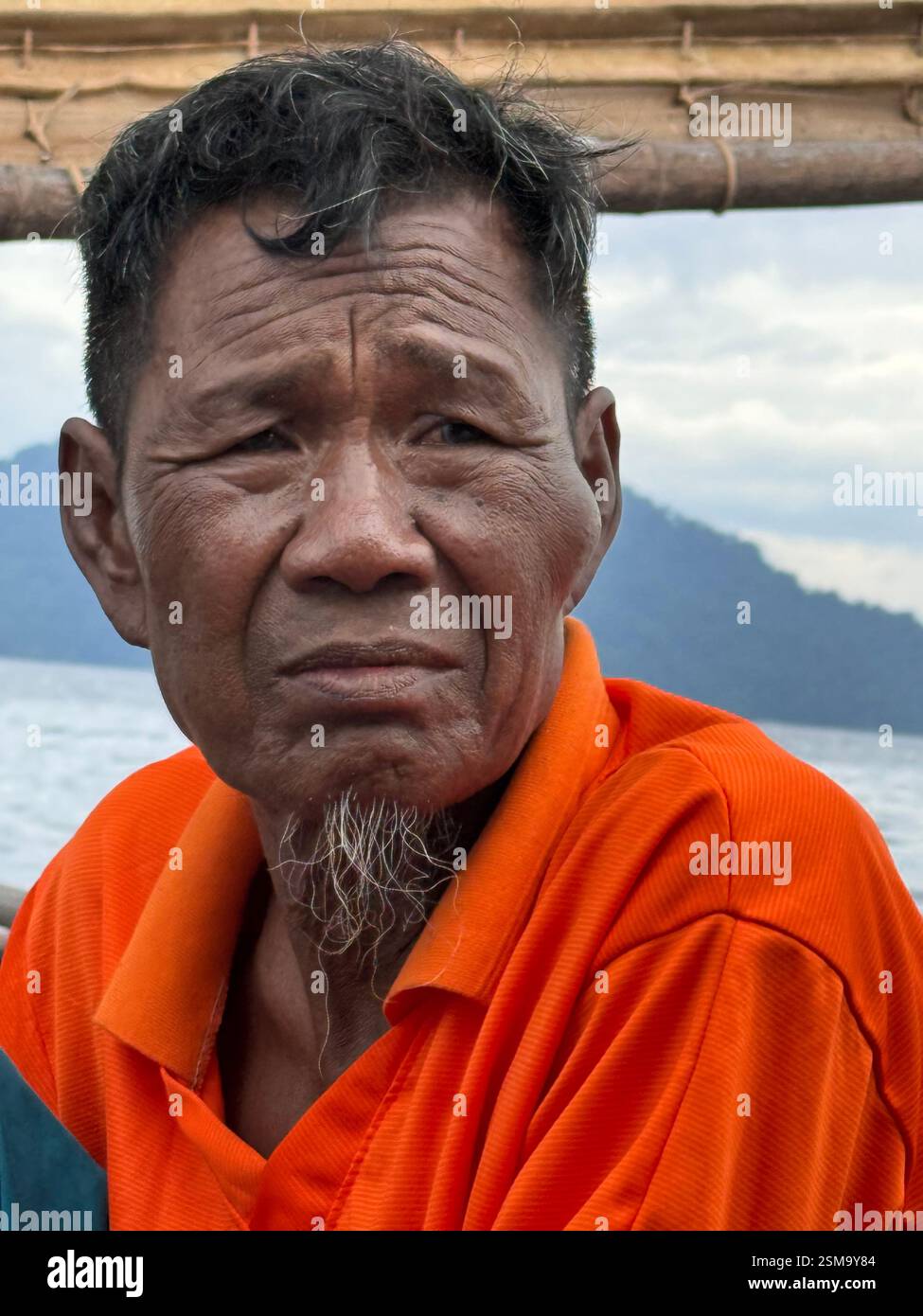 A Moken Sea Gypsy sails a traditional Moken Kabang boat in the waters ...