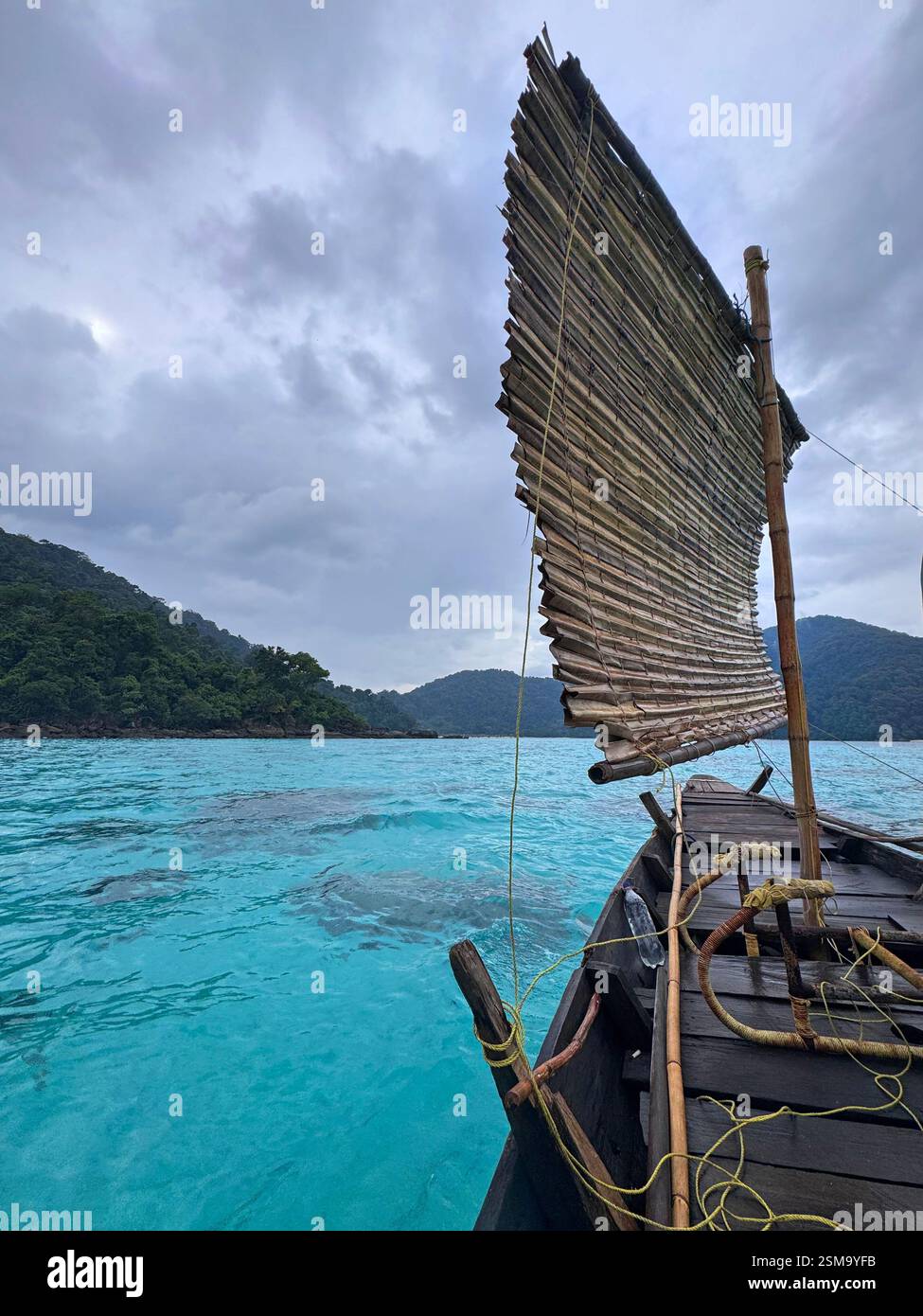 Sailing in a traditional Moken Kabang boat in the waters of Mu Ko Surin ...