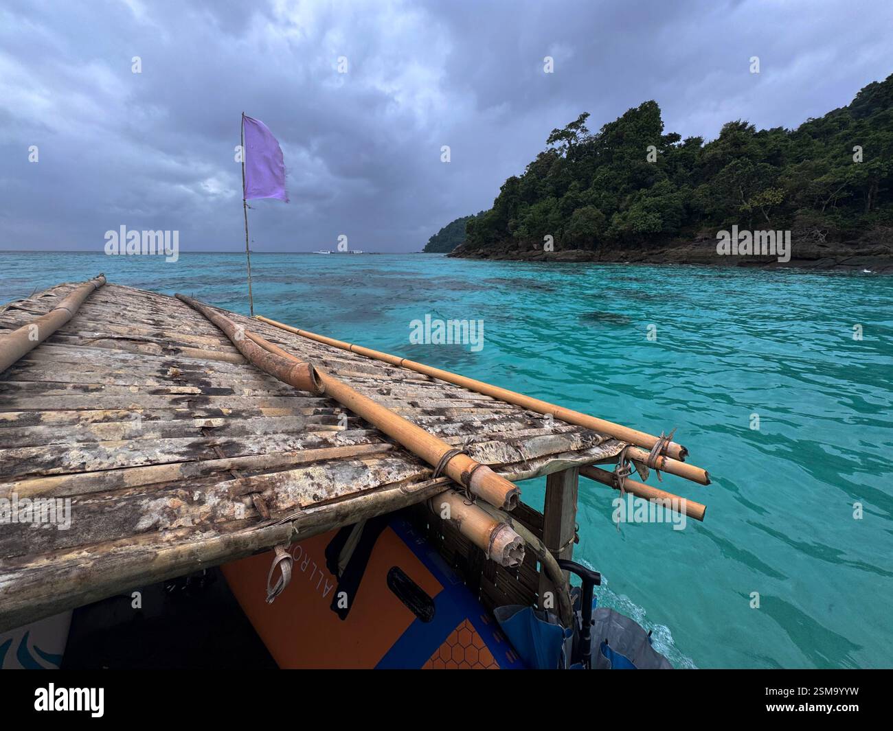 A Moken Sea Gypsyt sails a traditional Moken Kabang boat in the waters ...