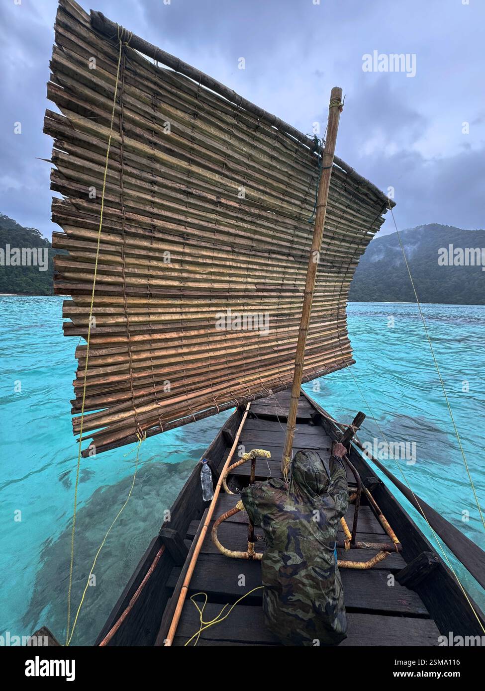 Sailing in a traditional Moken Kabang boat in the waters of Mu Ko Surin ...