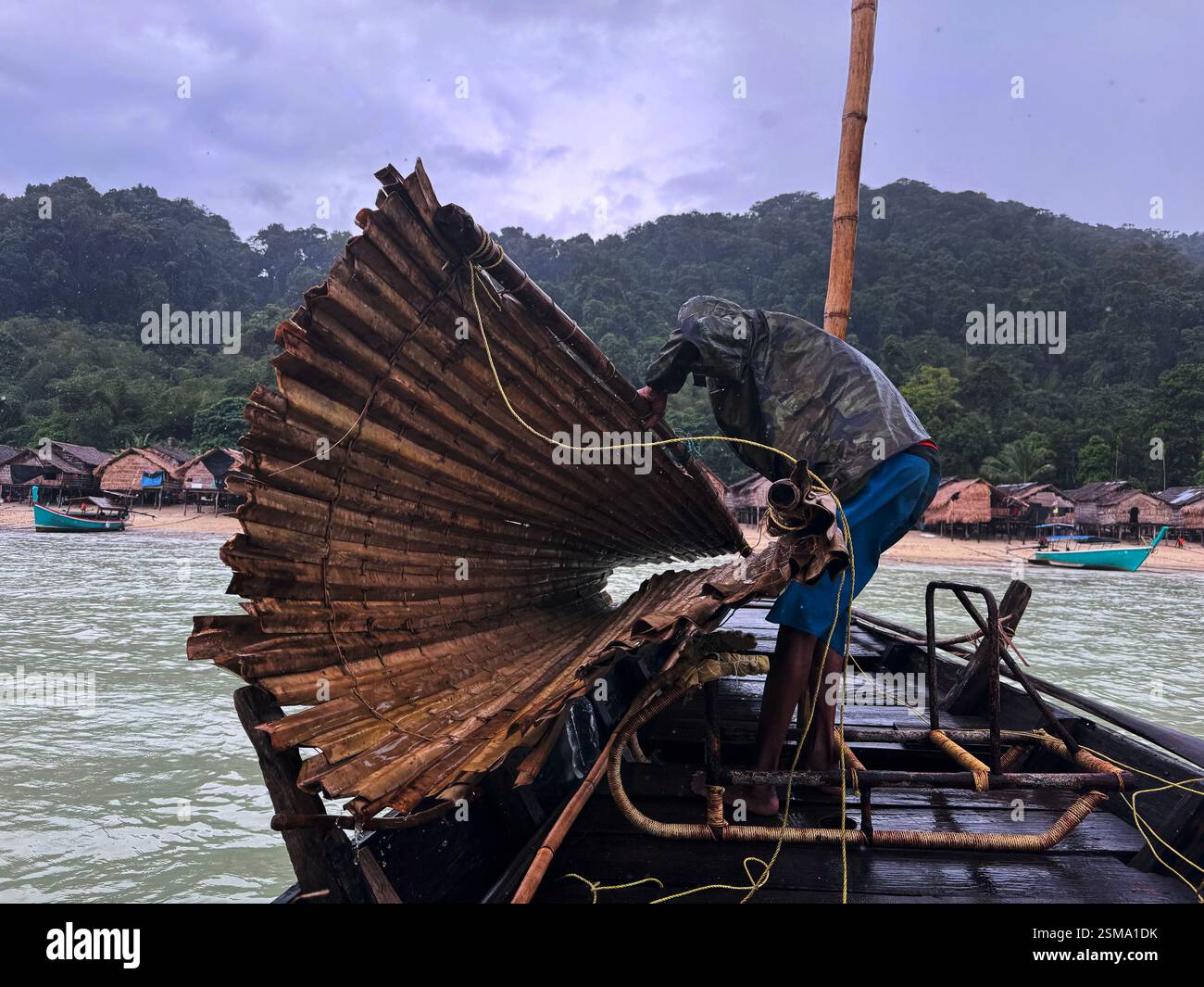 Sailing in a traditional Moken Kabang boat in the waters of Mu Ko Surin ...