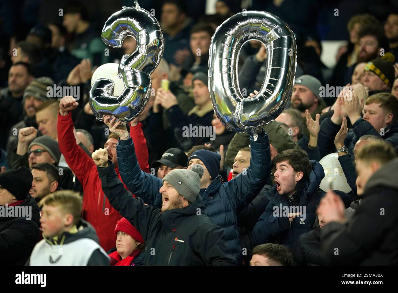 Fans hold up balloons to signify the years since Everton last won a ...