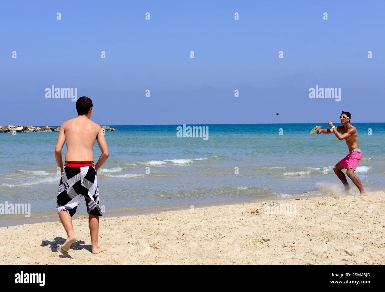 Playing Matkot ( paddle ball ) on the beach in Tel-Aviv, Israel Stock ...