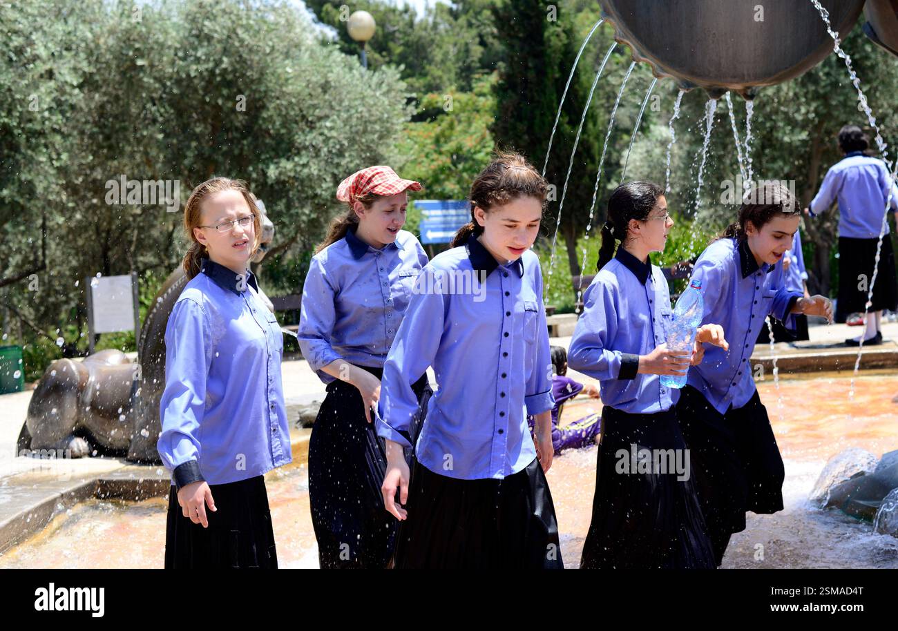Girls having fun in the water of the Lions fountain in Jerusalem ...