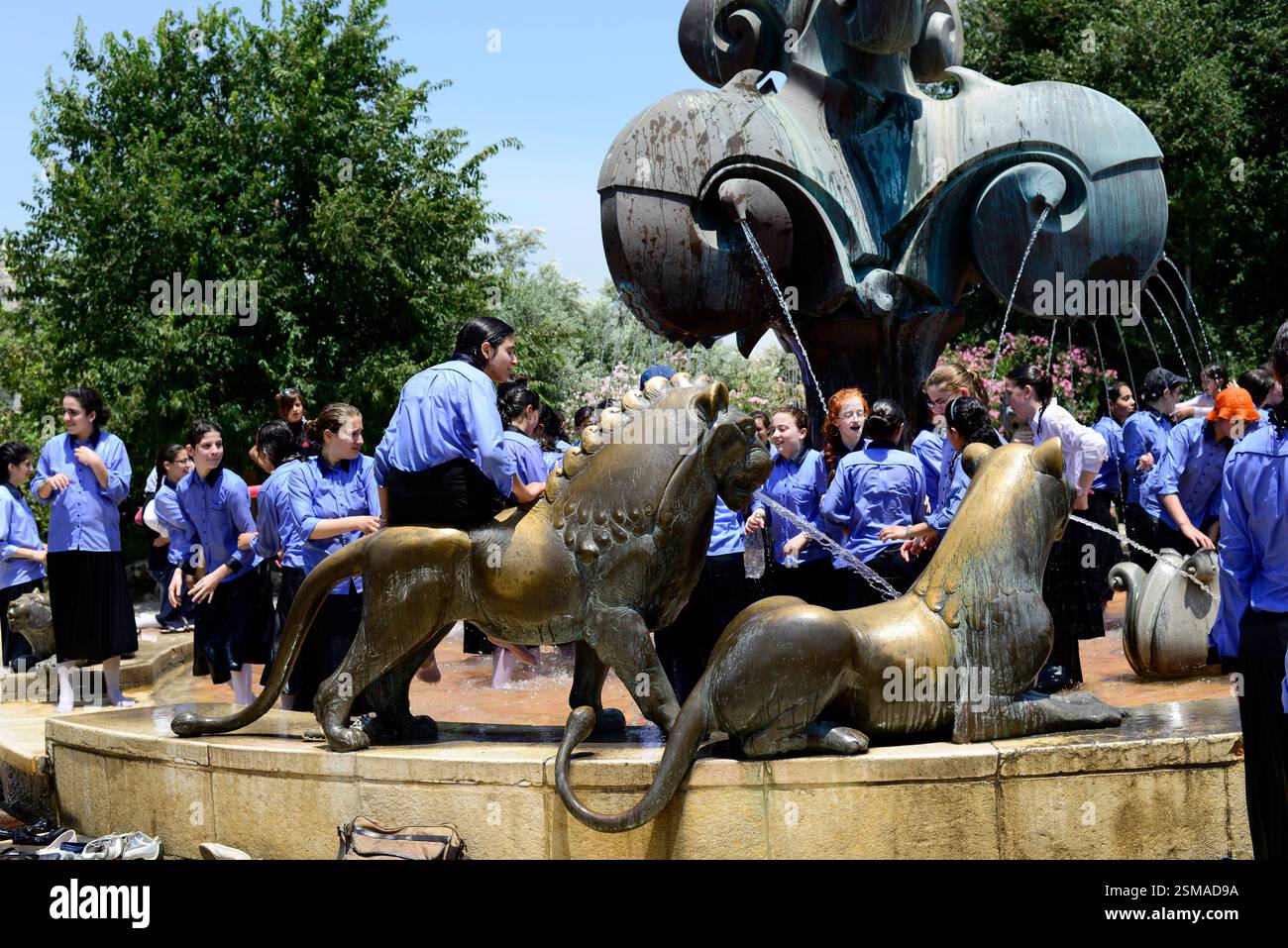 Girls having fun in the water of the Lions fountain in Jerusalem ...