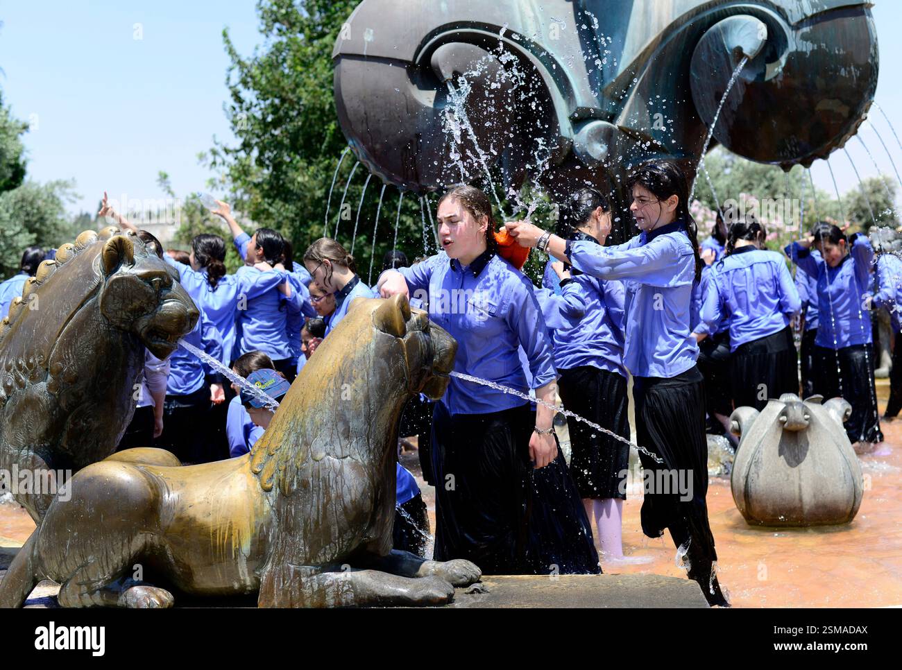 Girls having fun in the water of the Lions fountain in Jerusalem ...