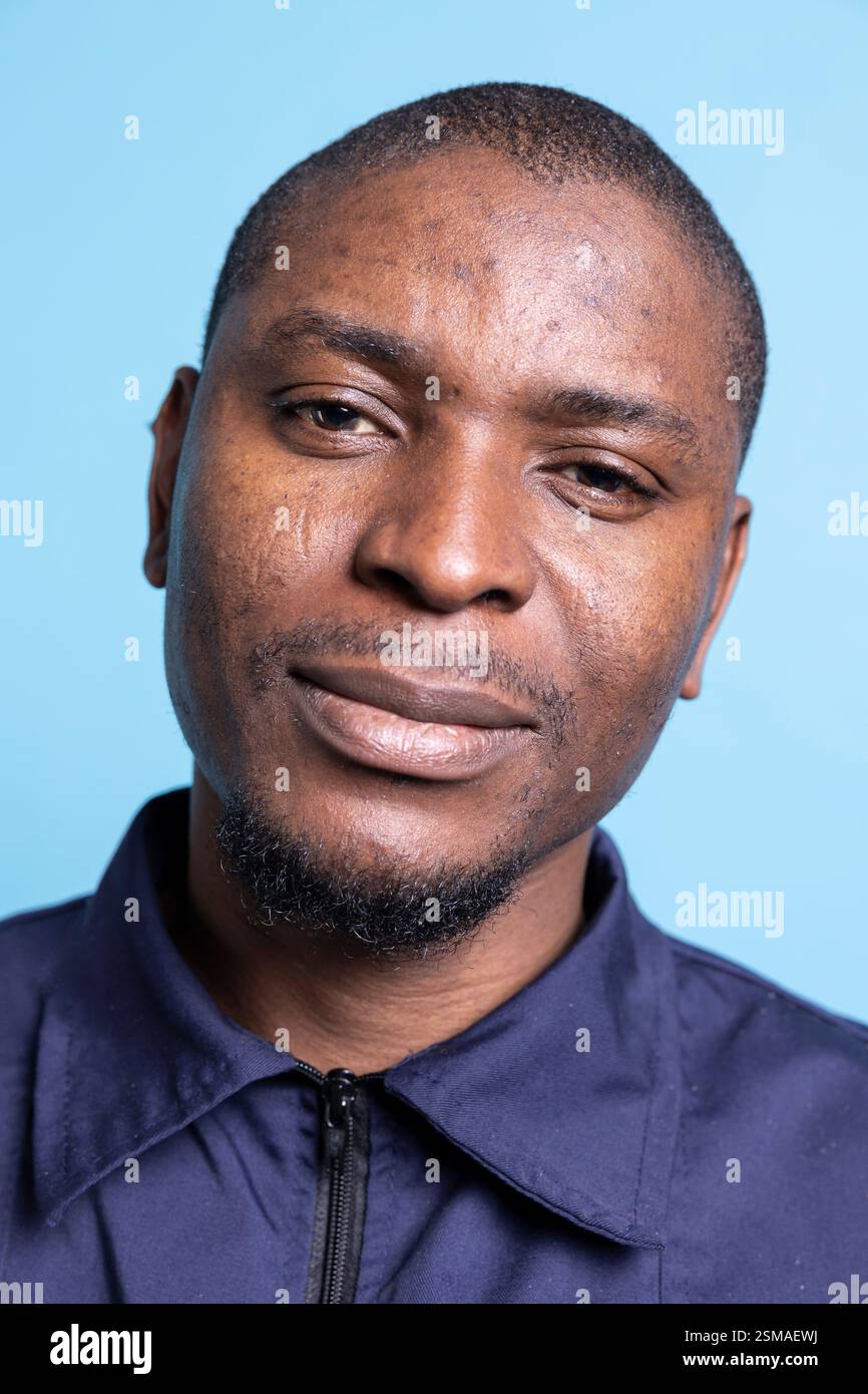 Portrait of happy male bodyguard in uniform posing on camera, standing ...