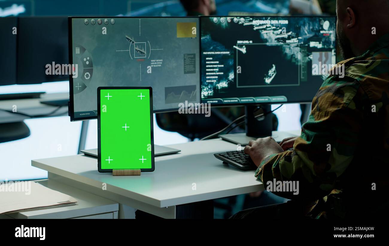 Military team operating in a high tech command post control tower ...