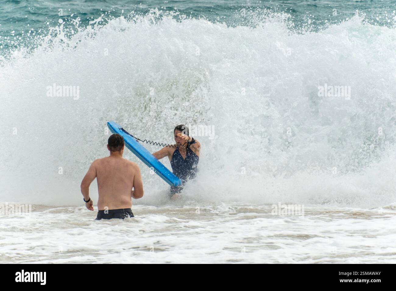 boogie boarding at Poipu beach Stock Photo - Alamy