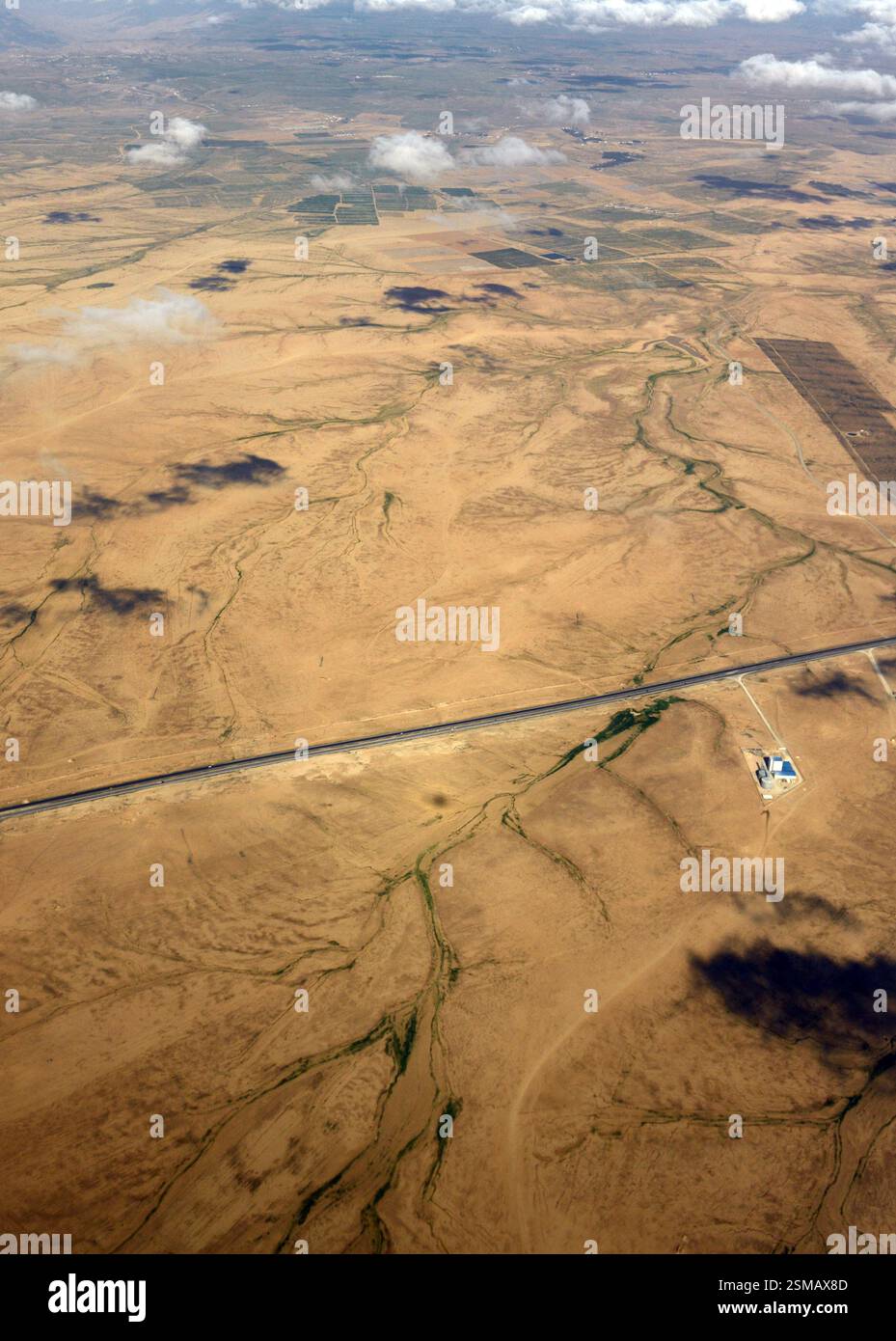 Aerial view of the Jordanian desert with small agricultural farms in ...