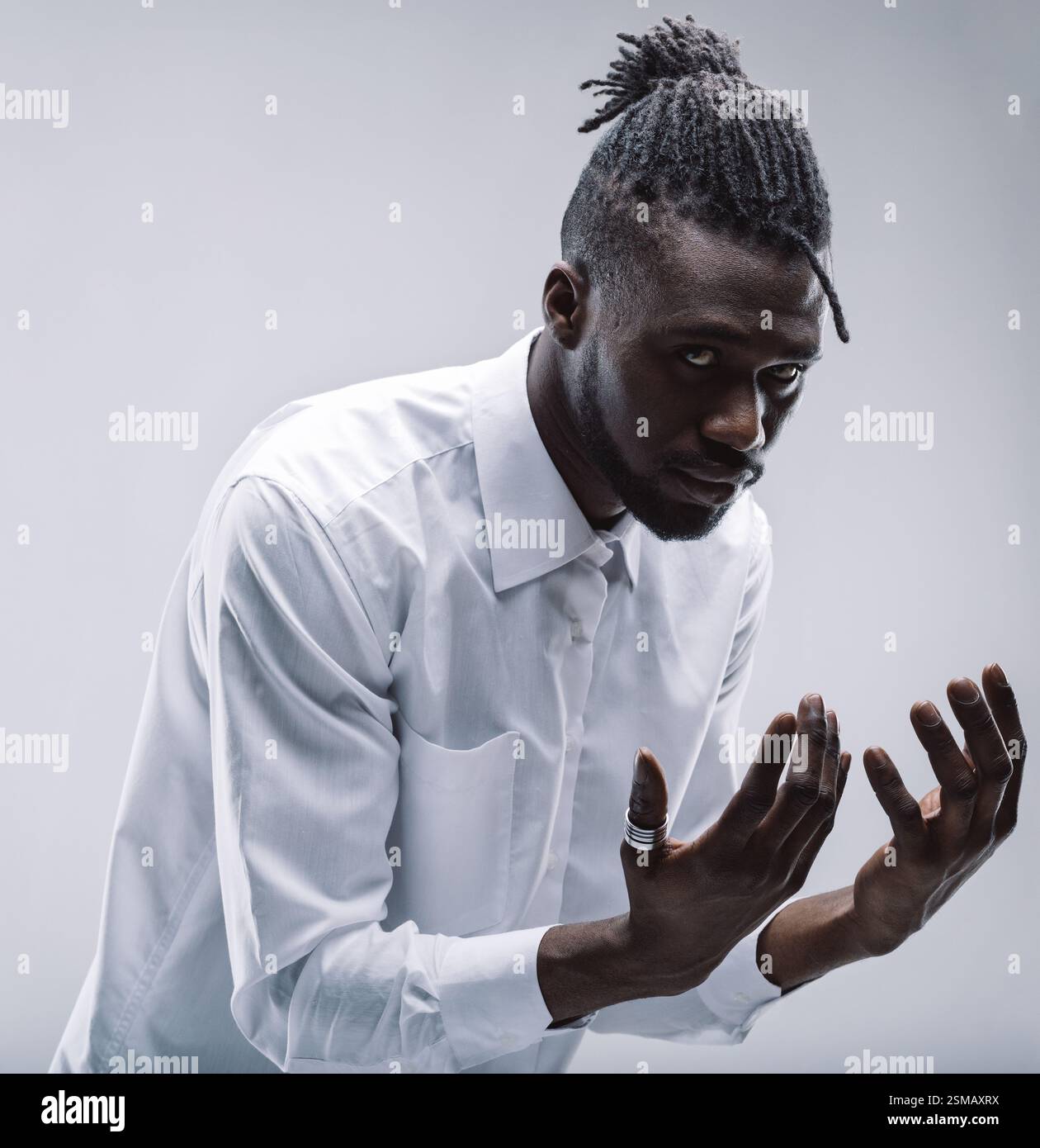 Young african american businessman with dreadlocks, wearing a crisp ...