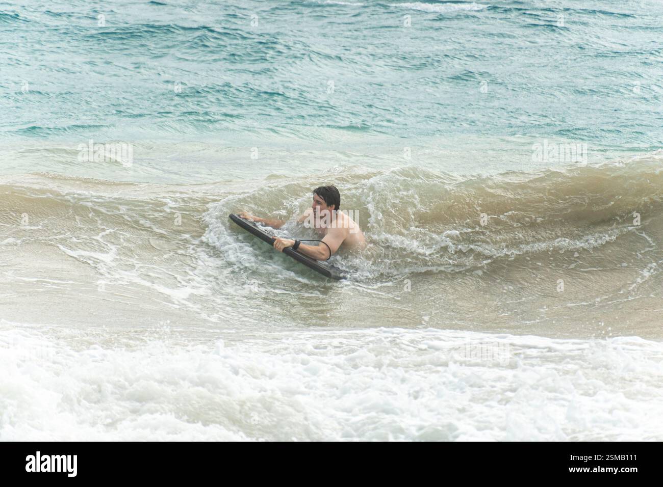 boogie boarding at Poipu beach Stock Photo - Alamy