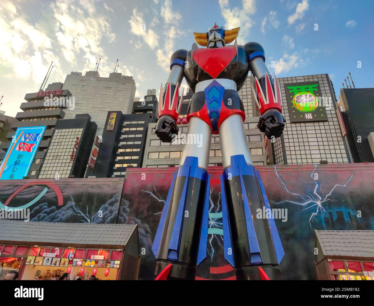 Riyadh,Saudi Arabia-Dec 25, 2025:Performers gazing at a giant Grendizer ...