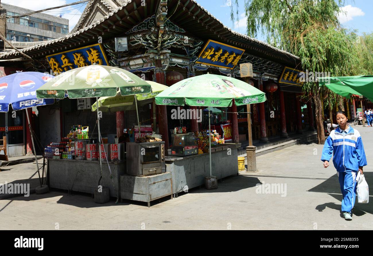 Souvenir and street food vendors in the Dafo temple complex in Zhangye ...