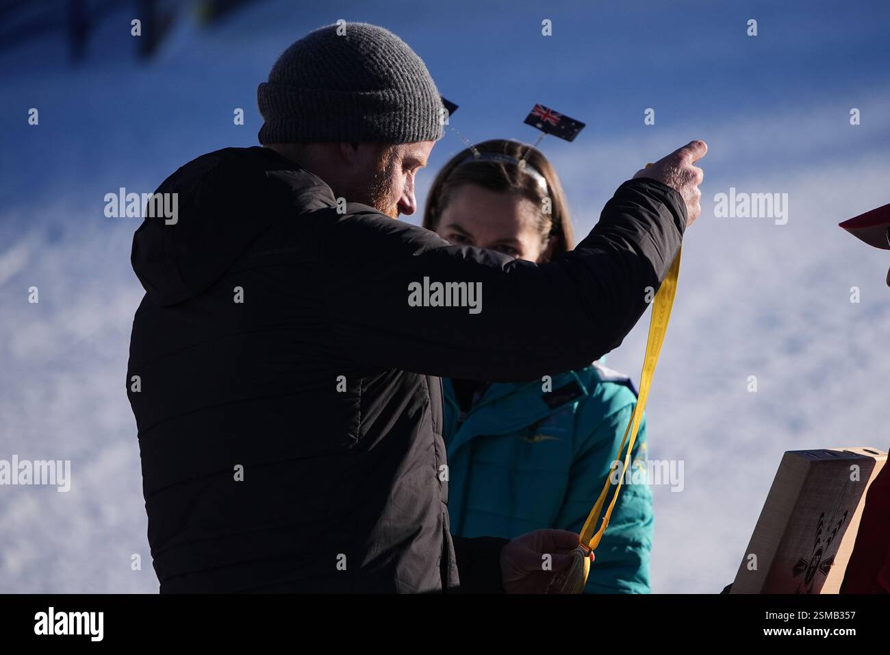 The Duke of Sussex hugs a competitor during a medal presentation for ...