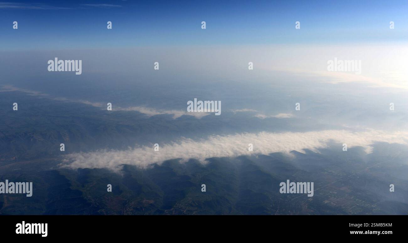Aerial View of Endless Mountain Ranges Covered by Soft Hazy Layers ...