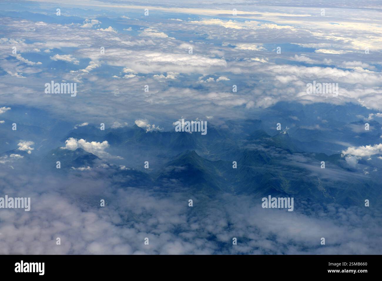 Aerial View of Endless Mountain Ranges Covered by Soft Hazy Layers ...