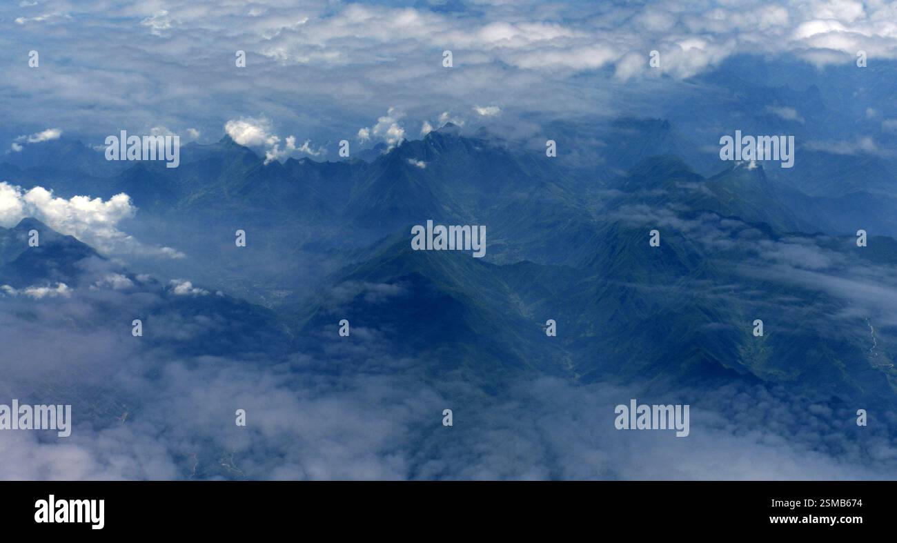 Aerial View of Endless Mountain Ranges Covered by Soft Hazy Layers ...