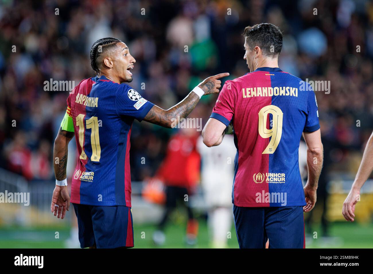 Barcelona, Spain. 23rd Oct, 2024. Raphinha (L) and Lewandowski (R ...